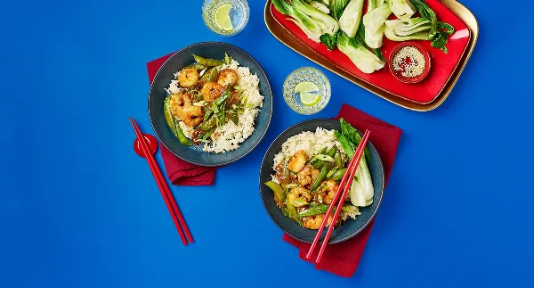 Sizzling prawns with ginger and spring onions